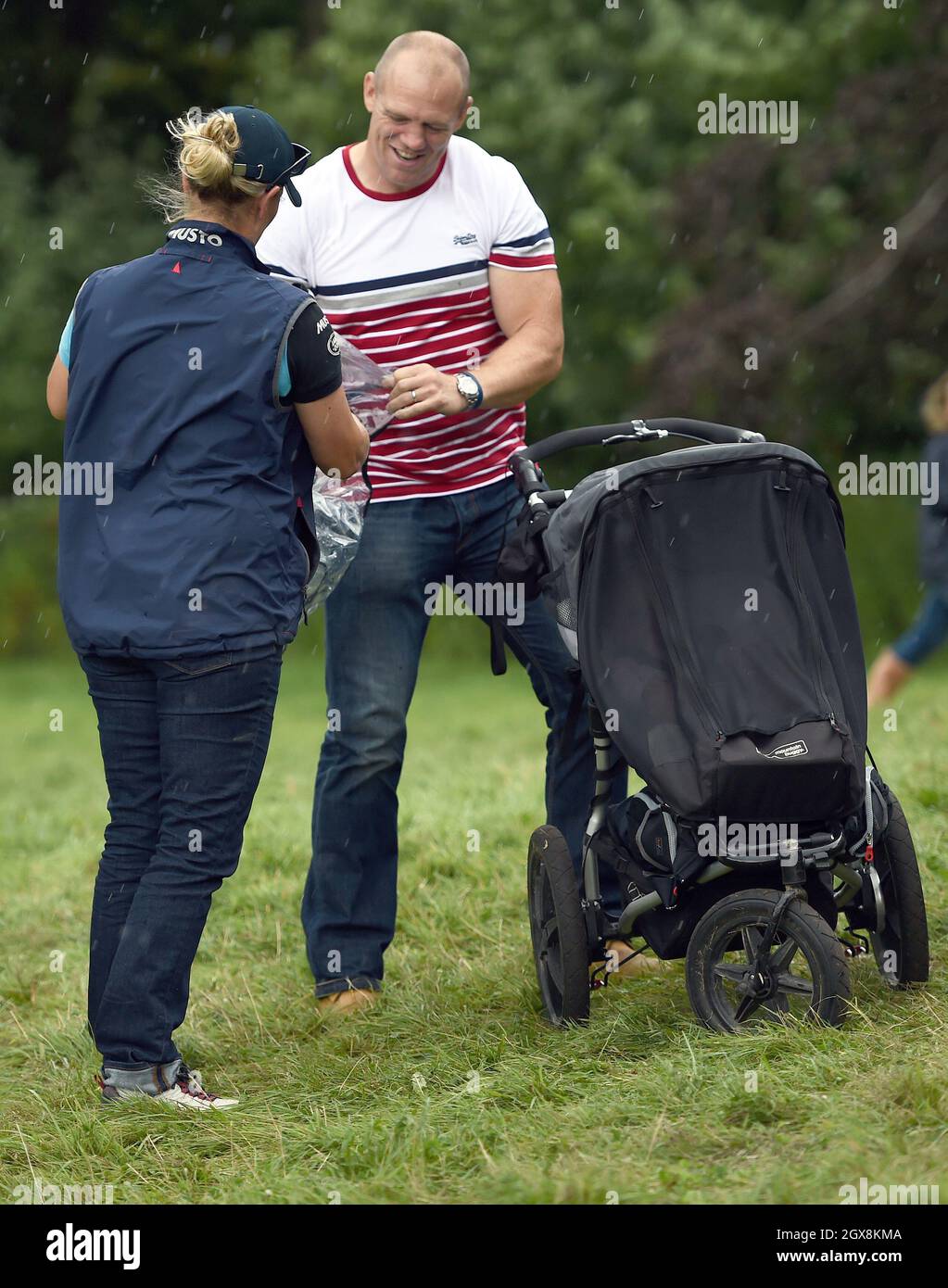 Zara Phillips and Mike Tindall with baby Mia Grace in a pushchair ...