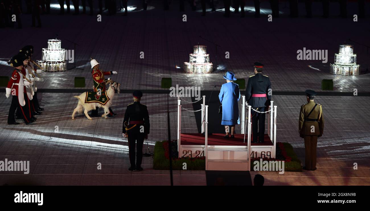 Queen Elizabeth ll watches a march past led by the regimental mascot ...