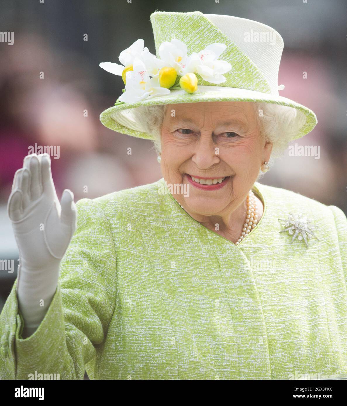Queen Elizabeth ll travels in an open top Range Rover as she celebrates ...