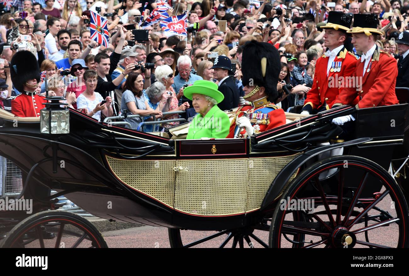 Queen Elizabeth ll and Prince Philip, Duke of Edinburgh ride in an open ...