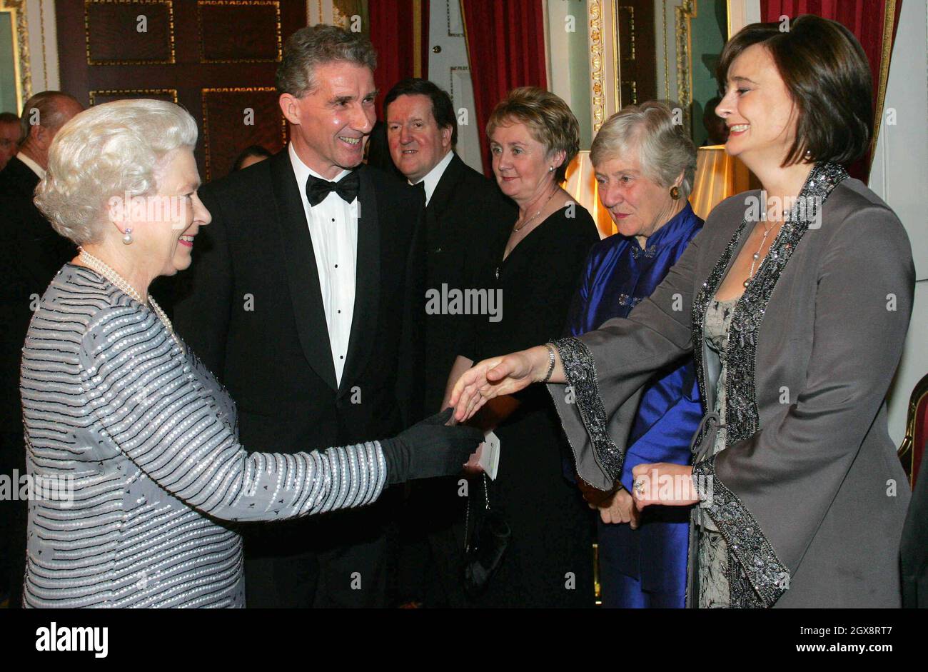 Queen Elizabeth II shakes hands with Cherie Blair at the Mansion House ...