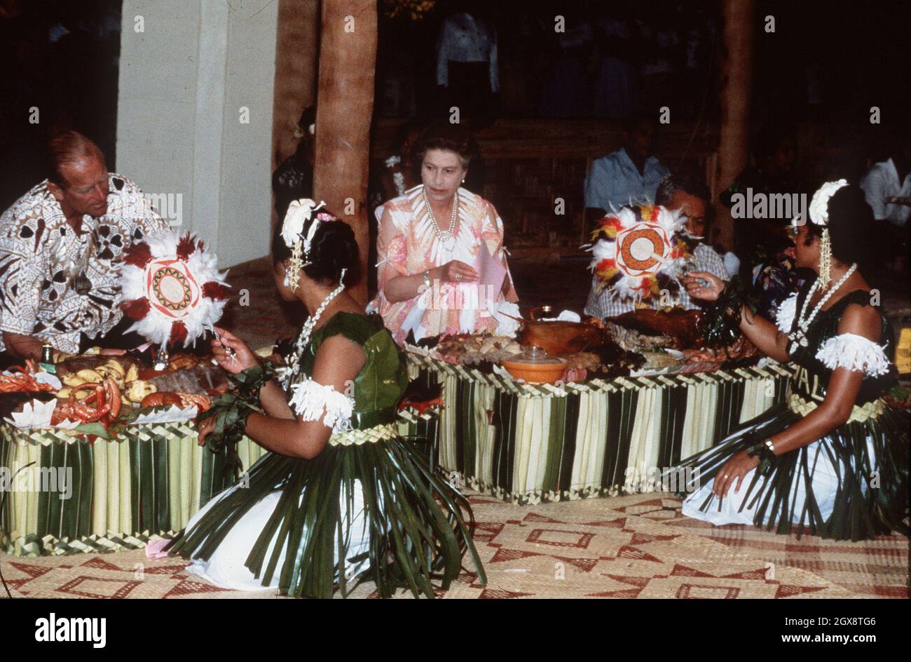 Queen Elizabeth II and the Duke of Edinburgh eating with their hands at ...