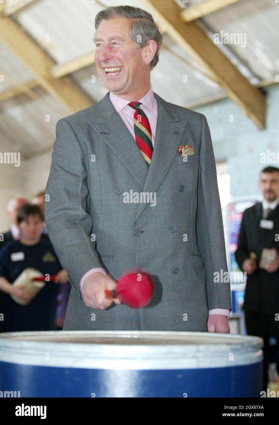 The Prince of Wales, plays on a drum made out of recycled scrap during ...