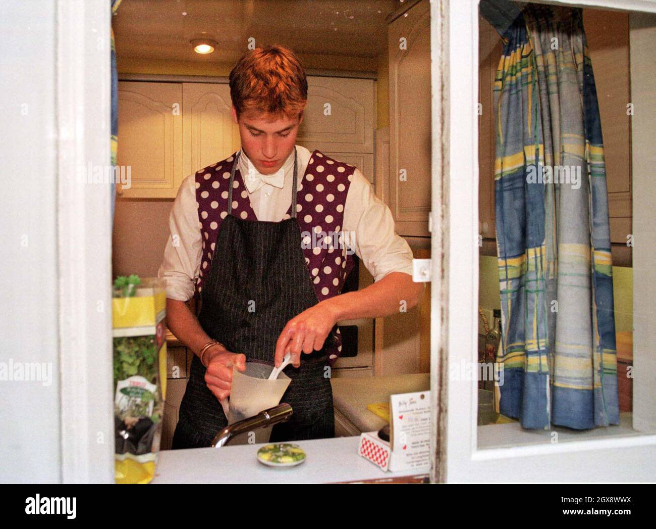 Prince William cooking at Eton, June 2000. Photo. Anwar Hussein Stock ...