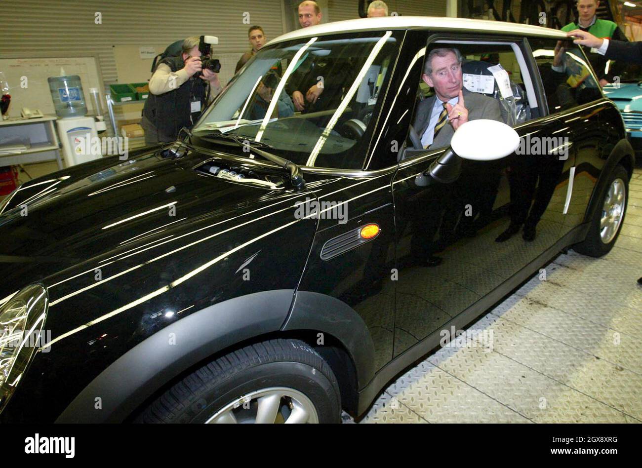The Prince of Wales looks at a Mini at BMW's Cowley plant in ...