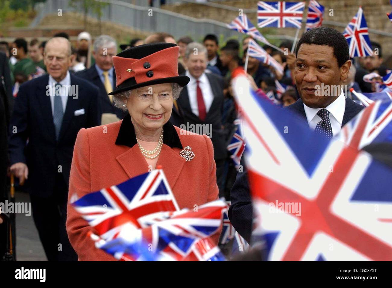 Britain's Queen Elizabeth II and the Duke of Edinburgh (left) are met ...