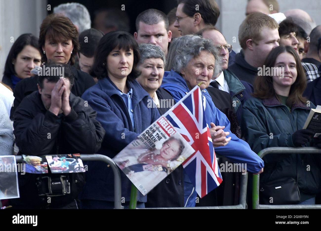 The british public watch the Queen Mother coffin being taken from ...