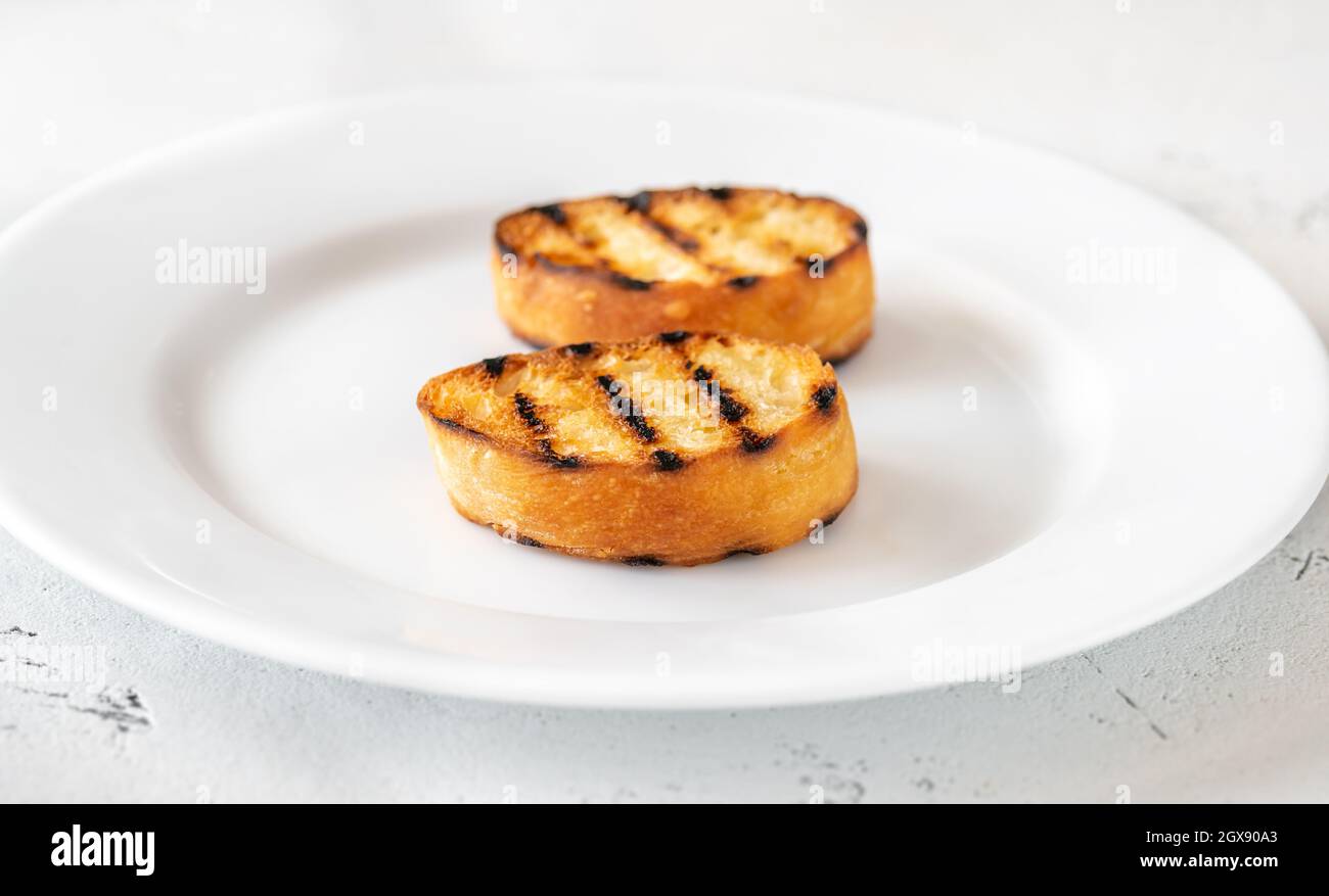 Brown toast two slices plate hi-res stock photography and images - Alamy