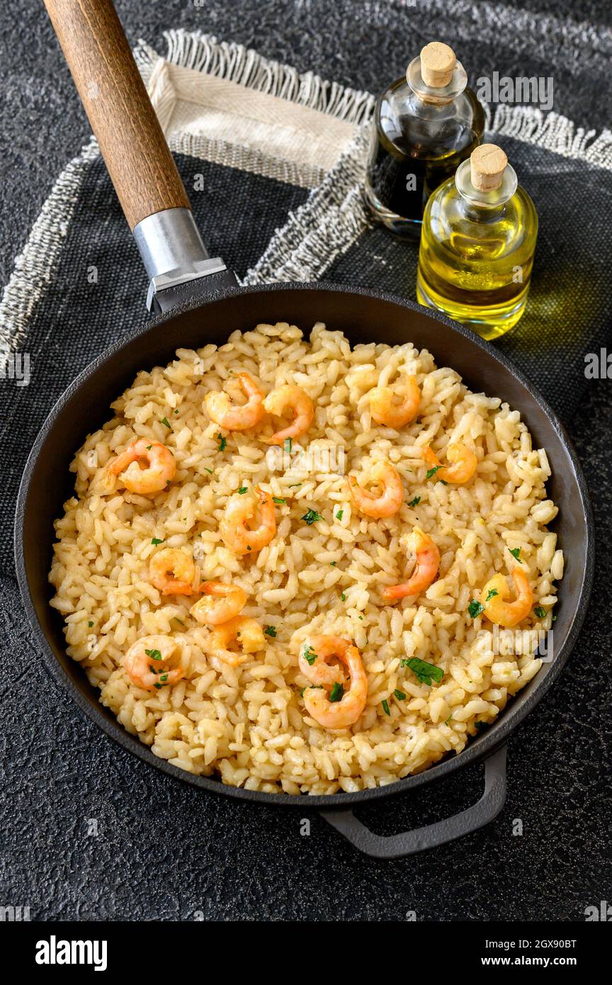 Homemade classic risotto with prawns in cooking pan Stock Photo - Alamy