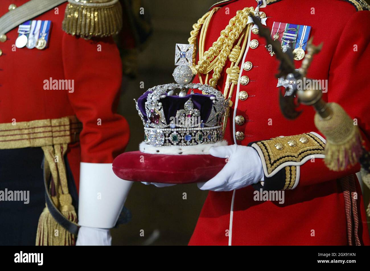The state crown is carried into the chamber for the State Opening of ...