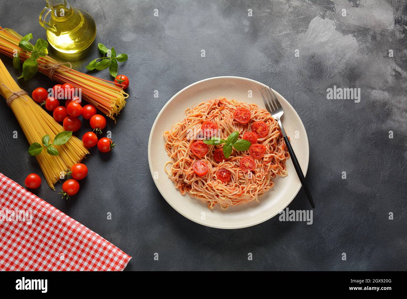 Classic Italian spaghetti pasta with tomato sauce and basil on plate ...