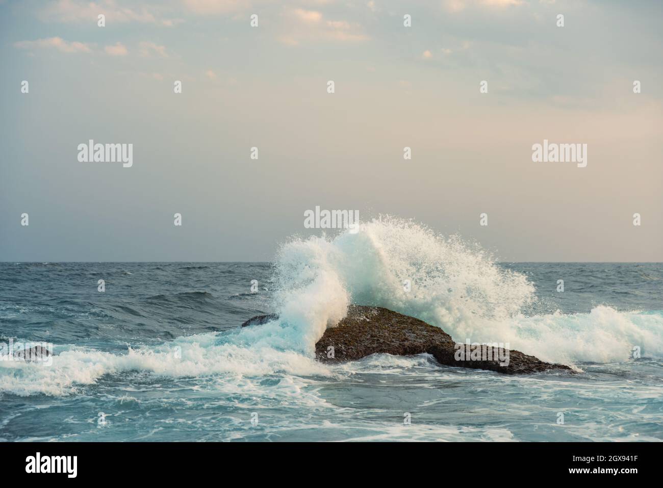 Wave and splashes at sunset. Beautiful sunset at Sri Lanka Stock Photo ...
