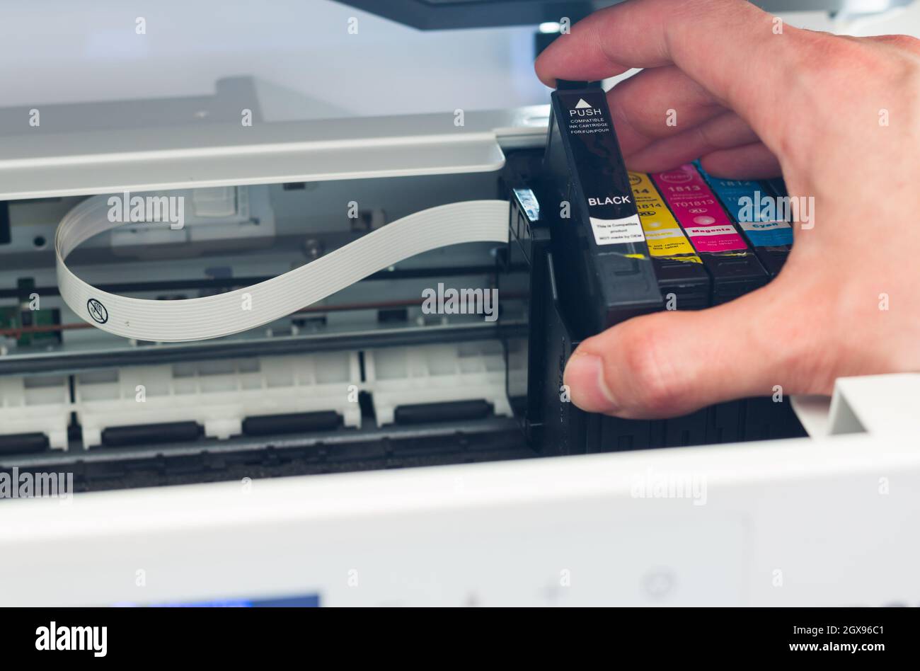 Putting new printer cartridge into the printer, inkjet Stock Photo - Alamy