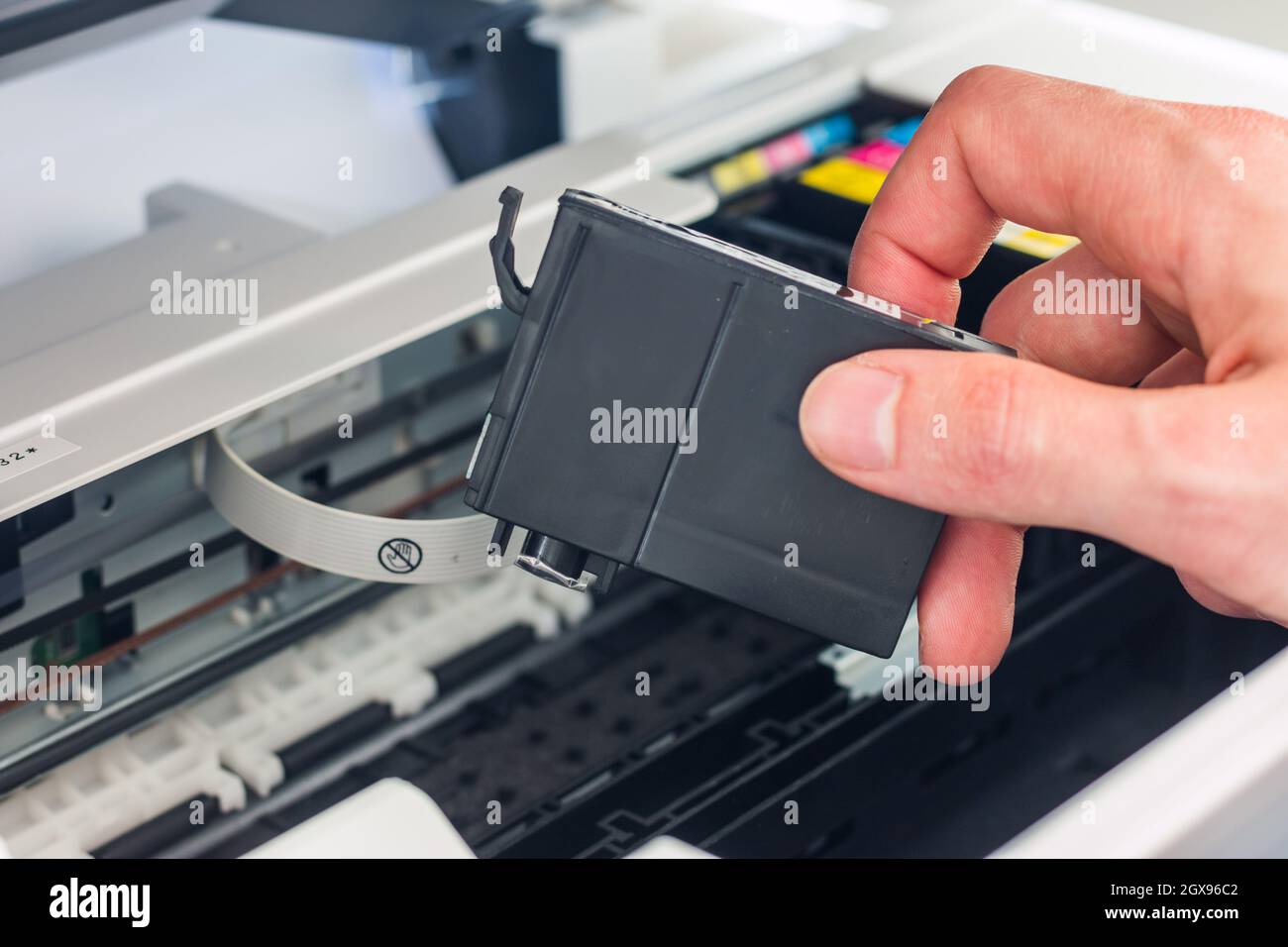 Putting new printer cartridge into the printer, inkjet Stock Photo - Alamy