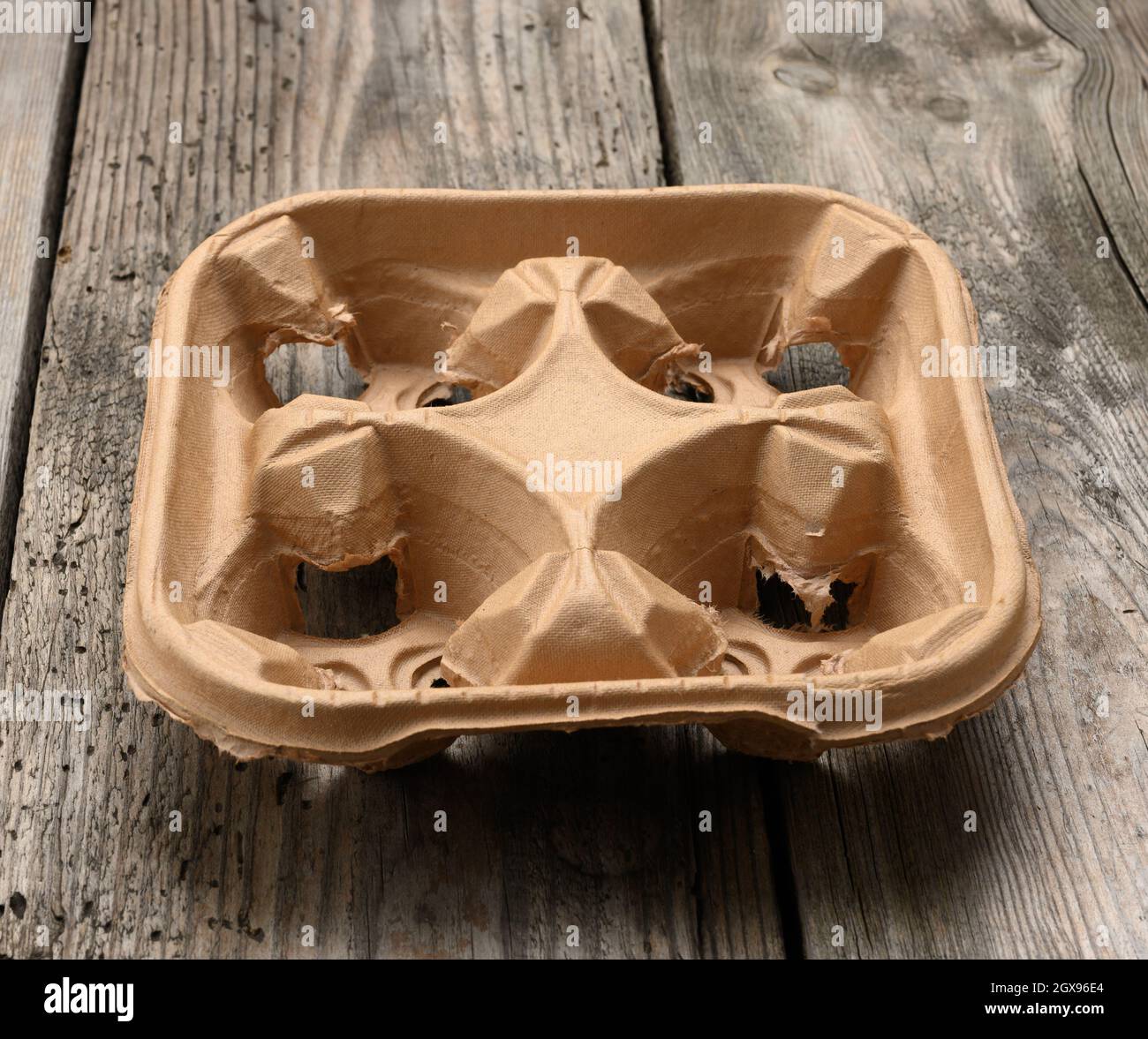 paper tray for drinks in takeaway cups on four cups on a brown wooden ...