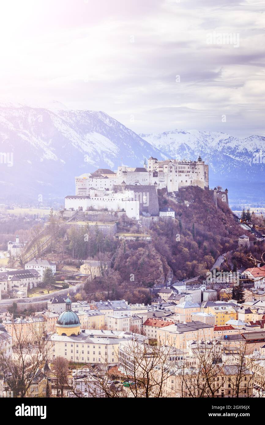 Fortress Hohensalzburg with snowy mountains in the background, autumn ...