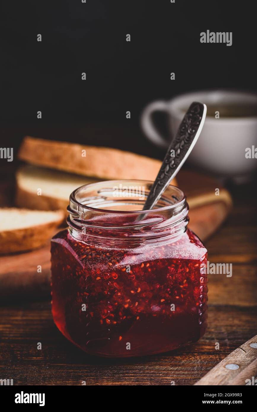 Jar of homemade raspberry jam. Toasts for breakfast Stock Photo - Alamy