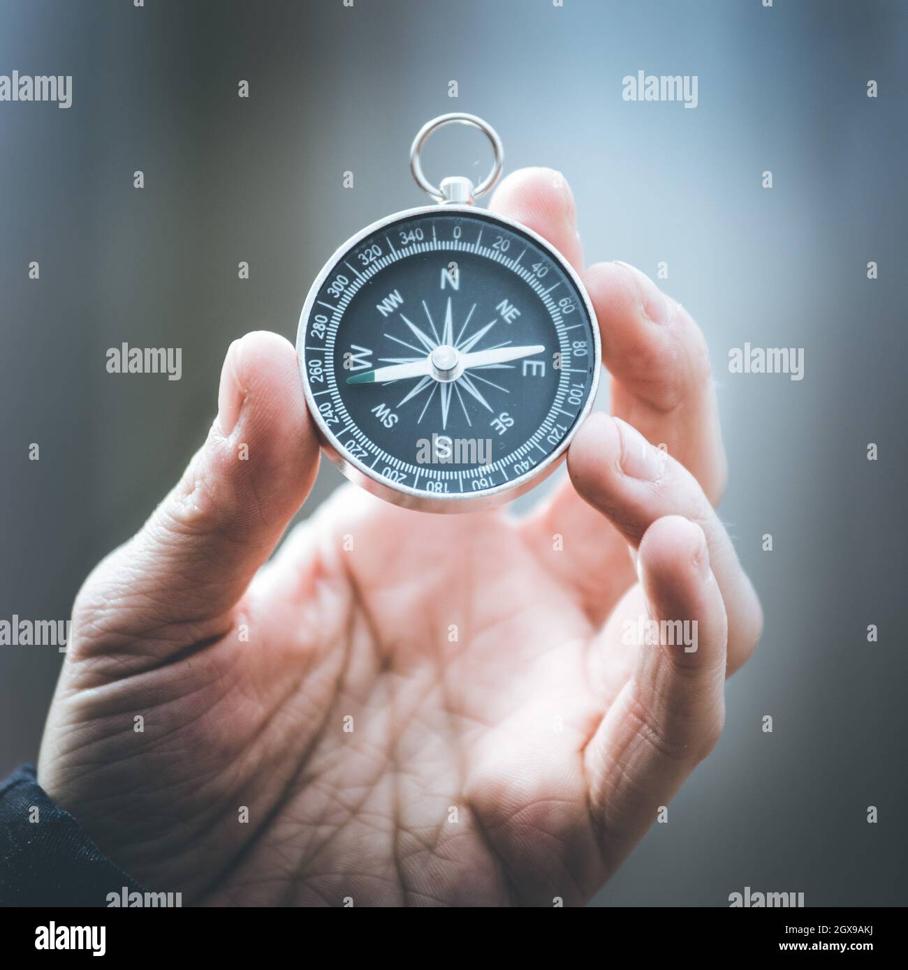 Business man holding compass hi-res stock photography and images - Alamy
