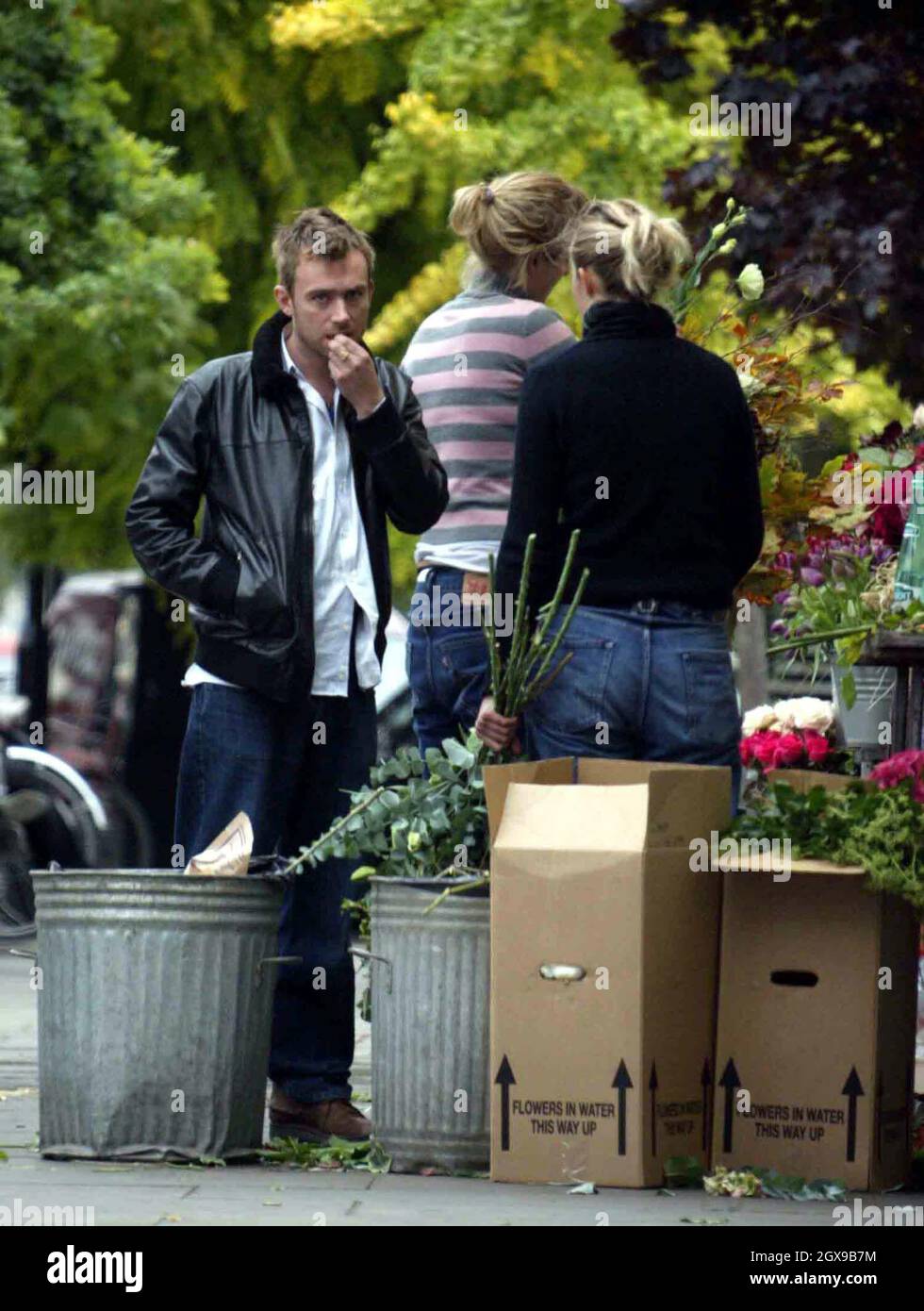 Damon Albarn out with his wife and baby daughter buying flowers Stock ...