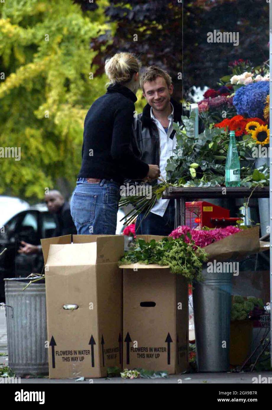 Damon Albarn out with his wife and baby daughter buying flowers Stock ...