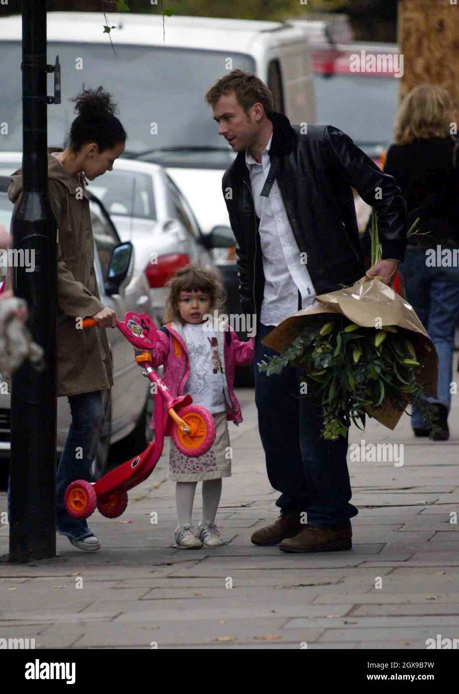 Damon Albarn out with his wife and baby daughter buying flowers Stock ...