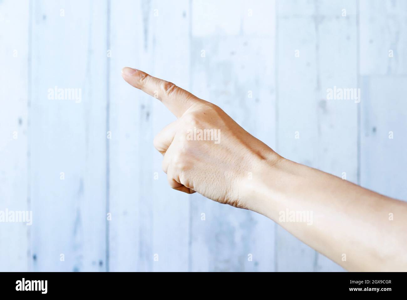Woman hand with the index finger pointing up Stock Photo - Alamy