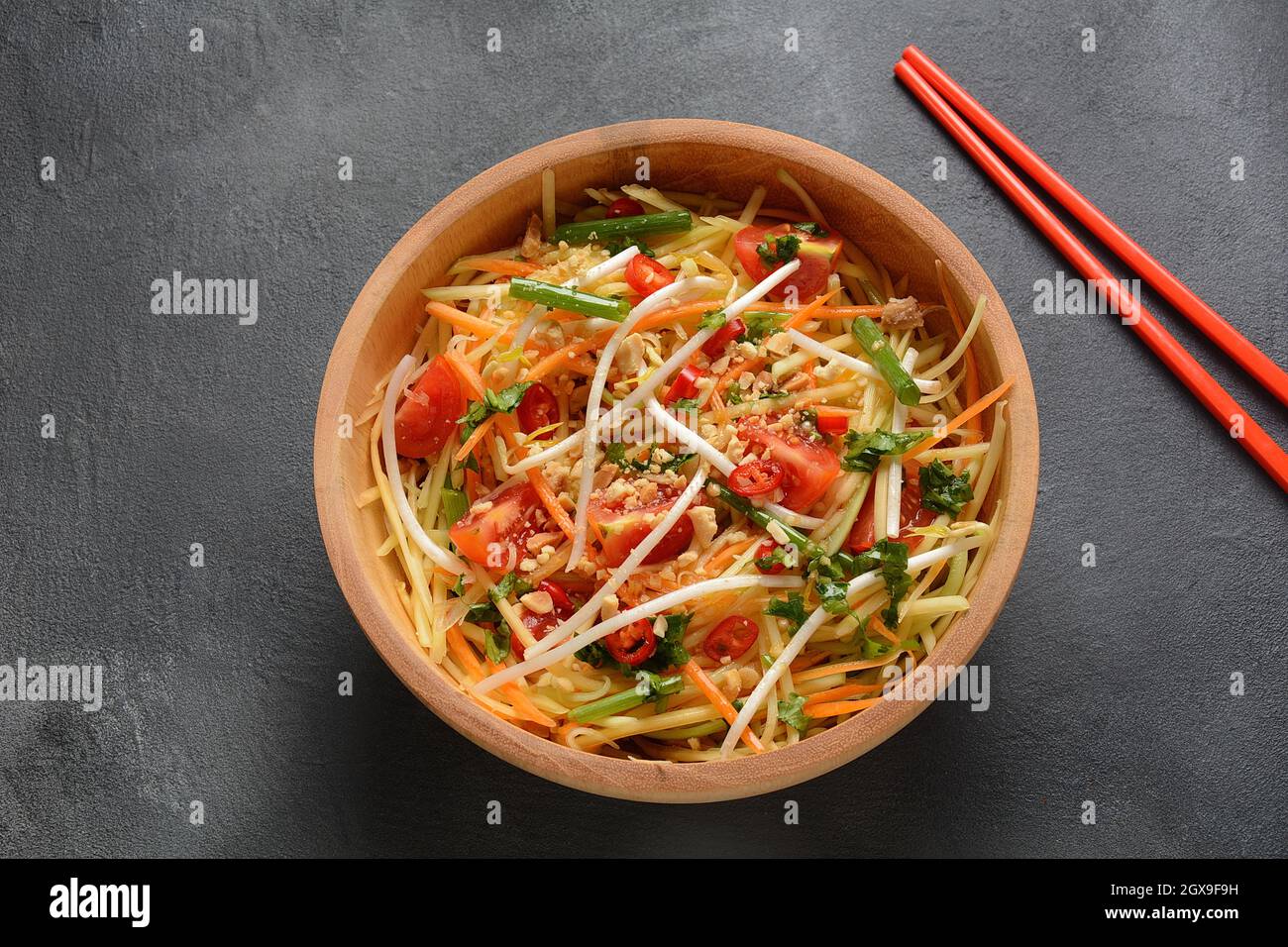 Delicious Som Tam -Thai green papaya salad) with green beans, tomatoes ...