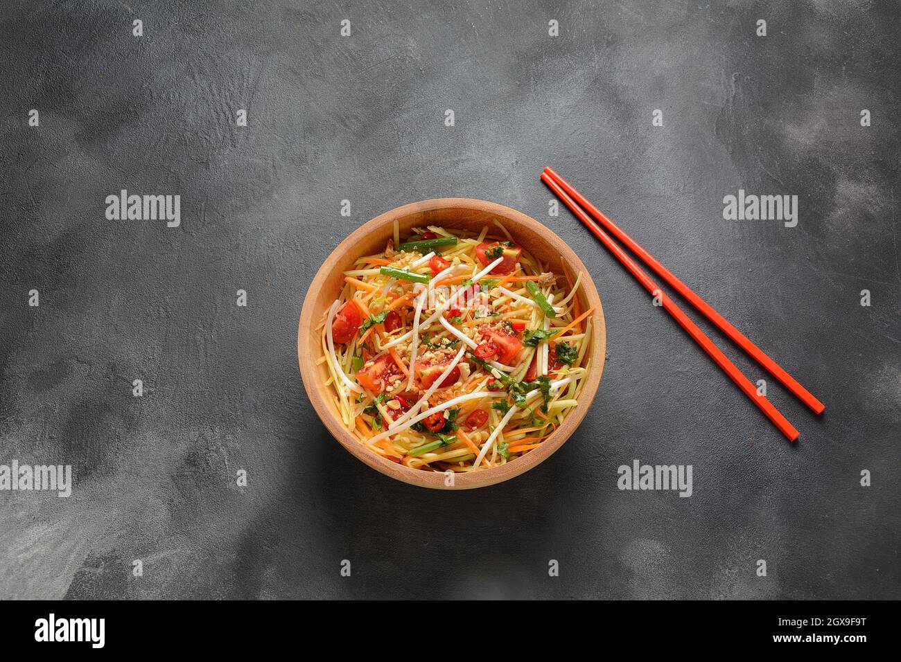 Delicious Som Tam -Thai green papaya salad) with green beans, tomatoes ...