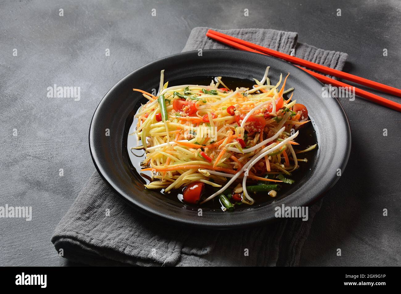 Delicious Som Tam -Thai green papaya salad) with green beans, tomatoes ...