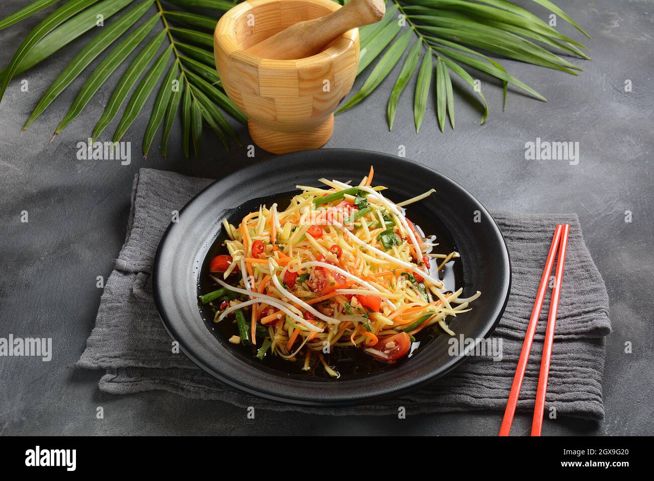 Delicious Som Tam -Thai green papaya salad) with green beans, tomatoes ...