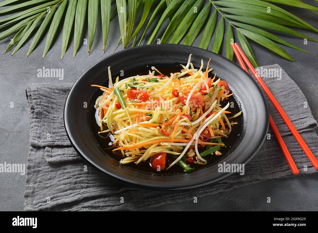 Delicious Som Tam -Thai green papaya salad) with green beans, tomatoes ...