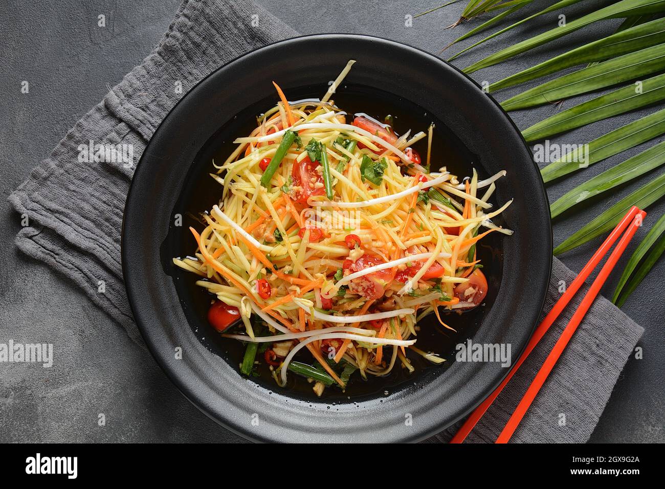 Delicious Som Tam -Thai green papaya salad) with green beans, tomatoes ...