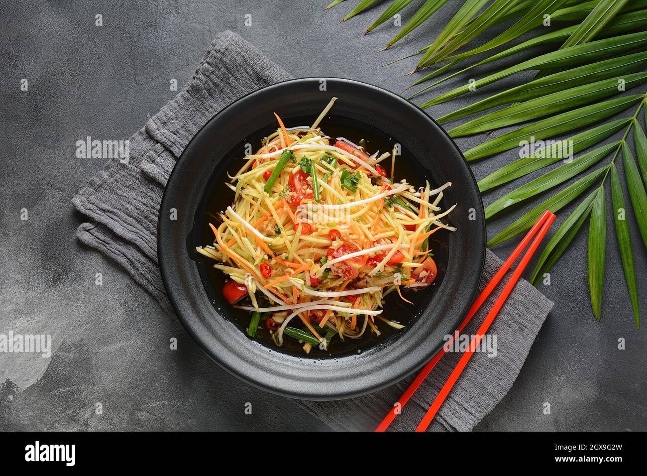 Delicious Som Tam -Thai green papaya salad) with green beans, tomatoes ...