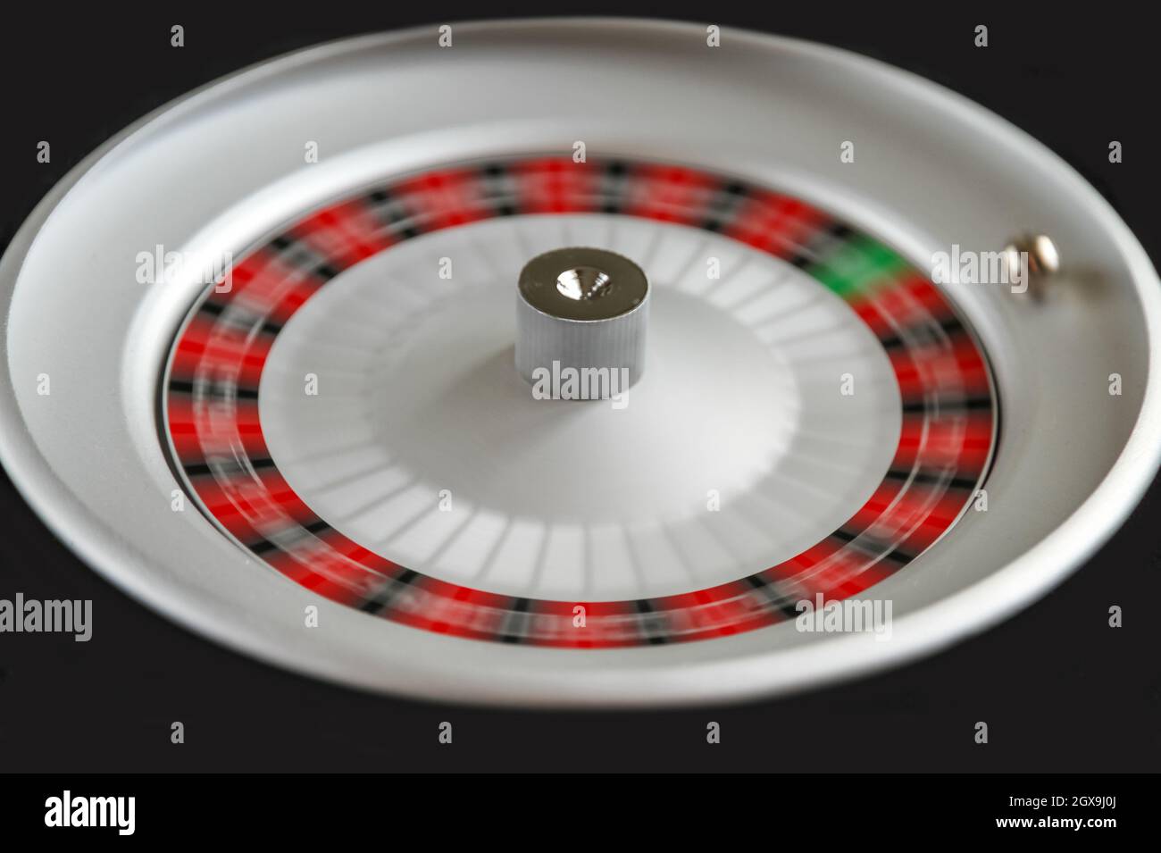 Casino roulette wheel isolated on Black background Stock Photo - Alamy