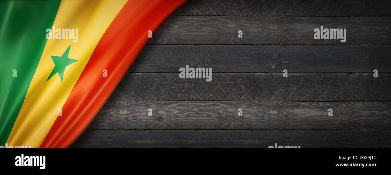 Senegal flag on black wood wall. Horizontal panoramic banner Stock ...