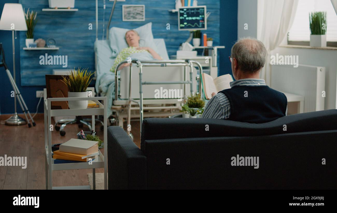 Aged man calling for doctor and nurse to help sick woman in hospital ...