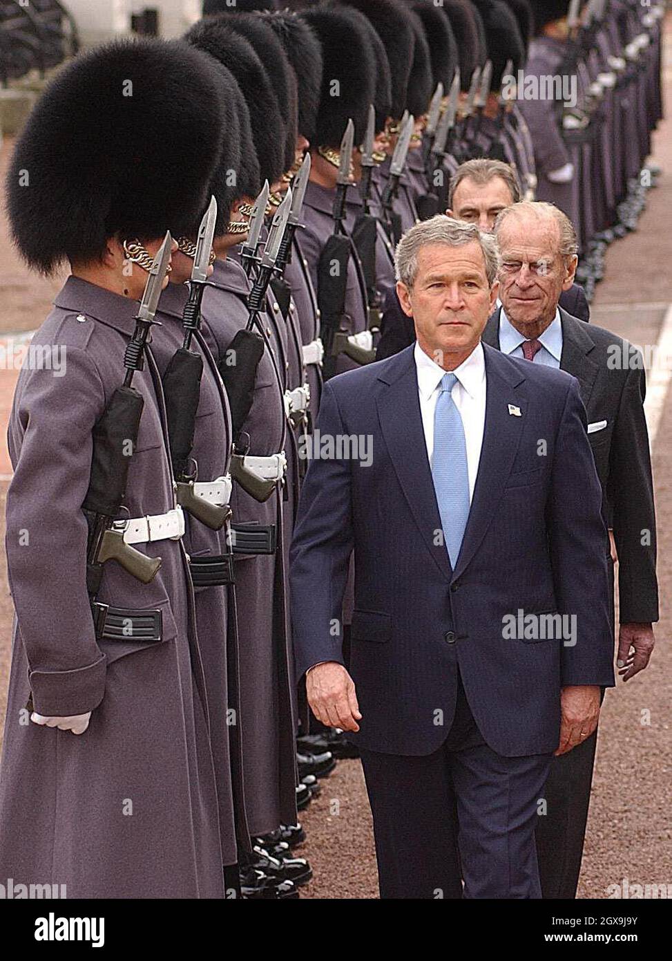 US President George Bush (Front) walks with The Duke of Edinburgh ...