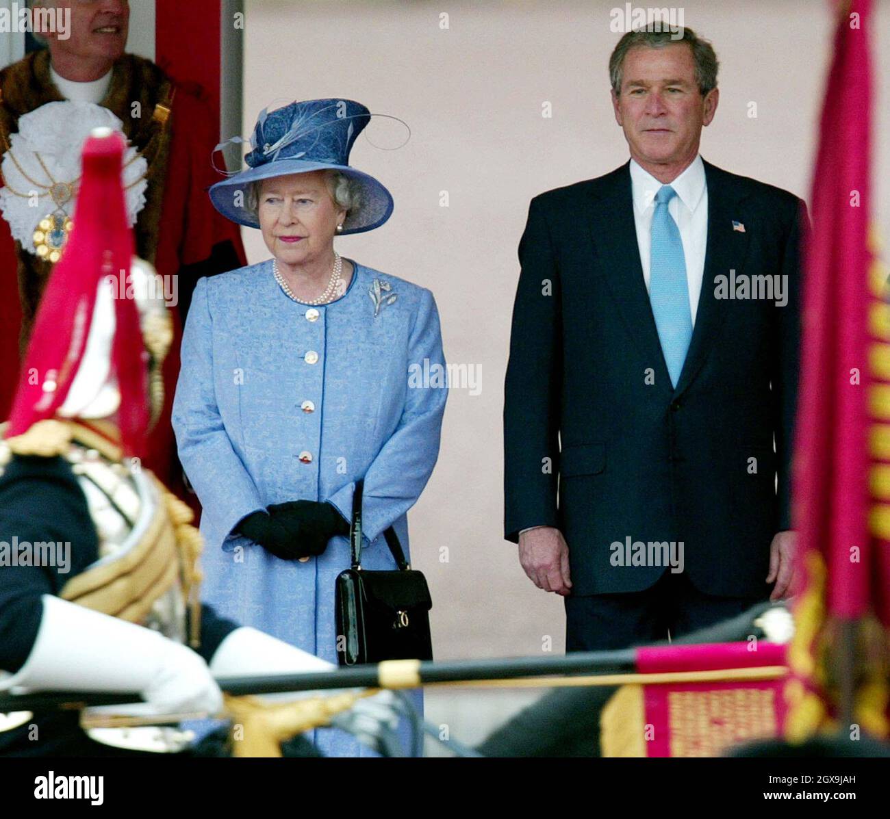 U.S. President George W. Bush (R) stands with Britain's Queen Elizabeth ...