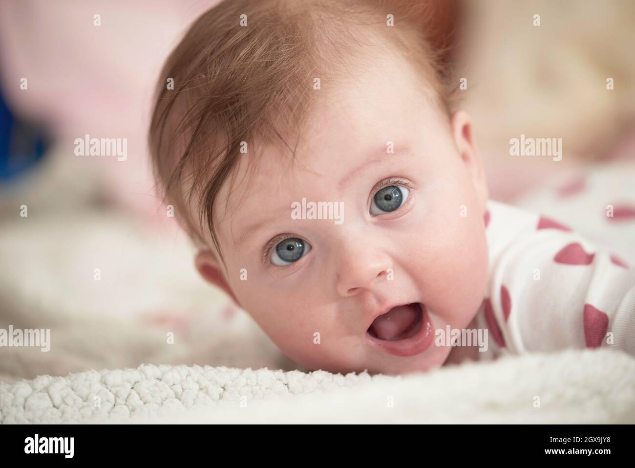 cute little baby playing with hand and smiling with no teeth funny ...