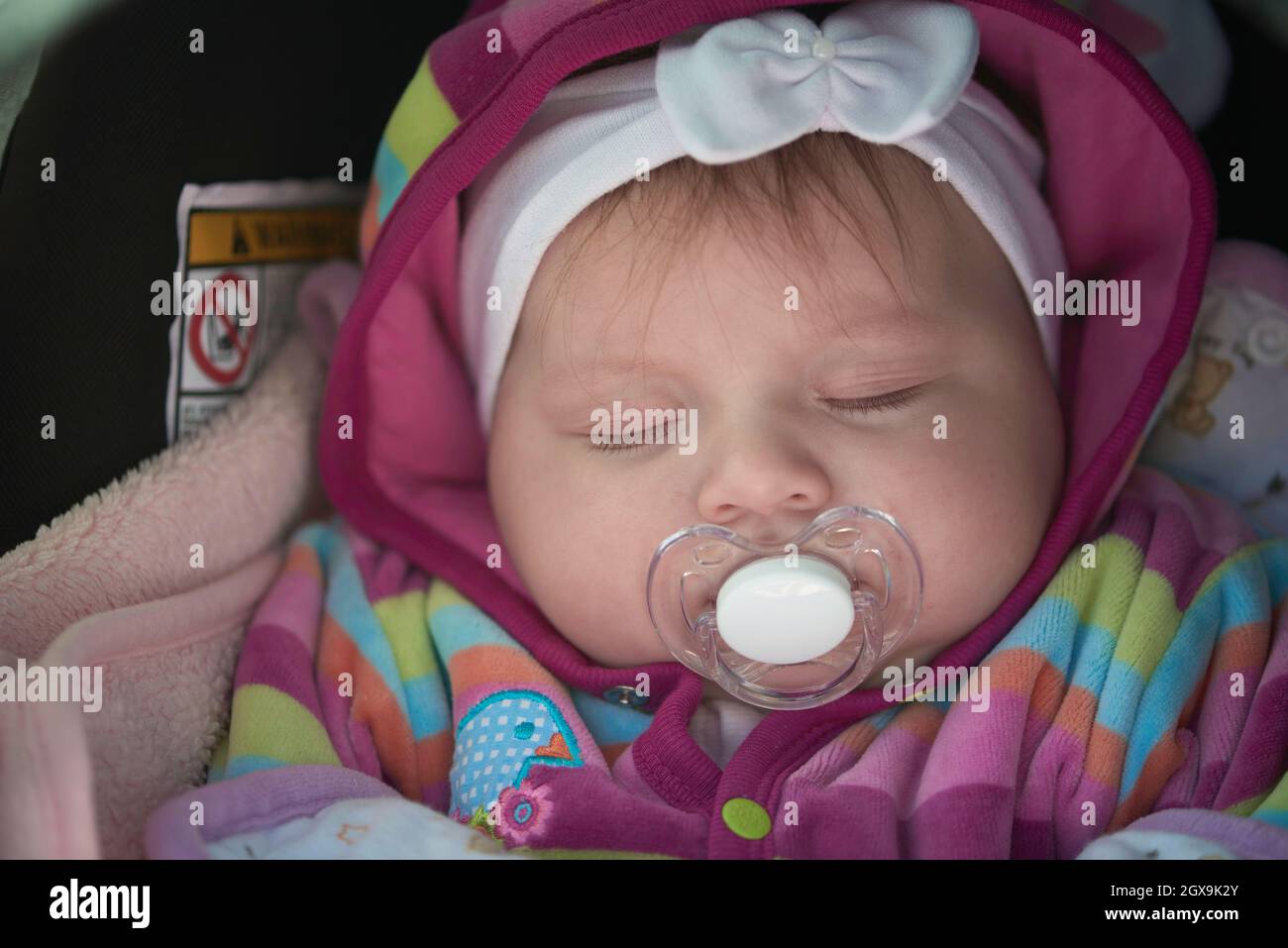 newborn baby girl sleeping in bed at home Stock Photo - Alamy