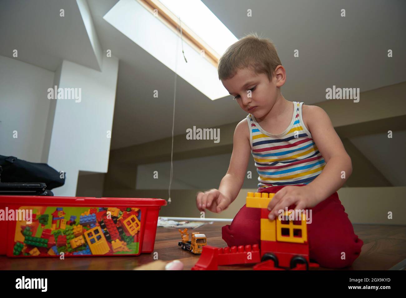 Little boy child playing with creative plastic toys indoor, building ...