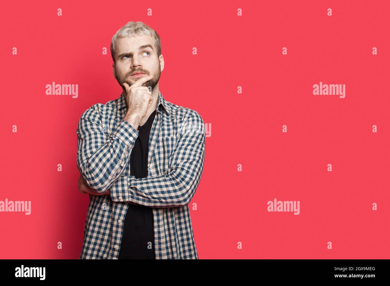 Blonde man gesturing think sign. Advertising banner. Man touching his ...