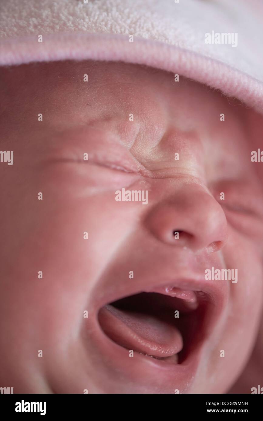 newborn baby crying and screaming cause is hungry Stock Photo - Alamy