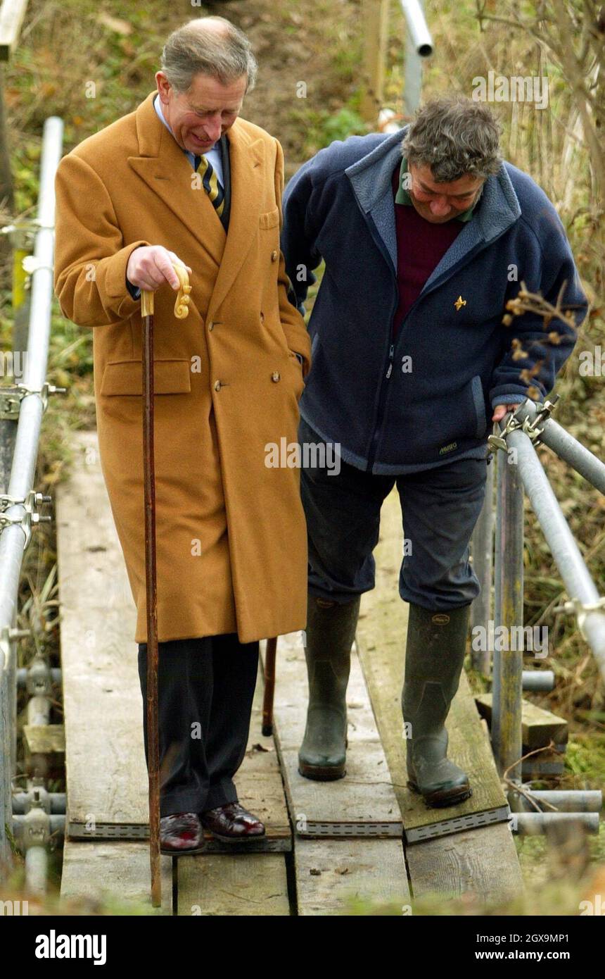 The Prince of Wales (left) is shown around by Robin Page, during a ...