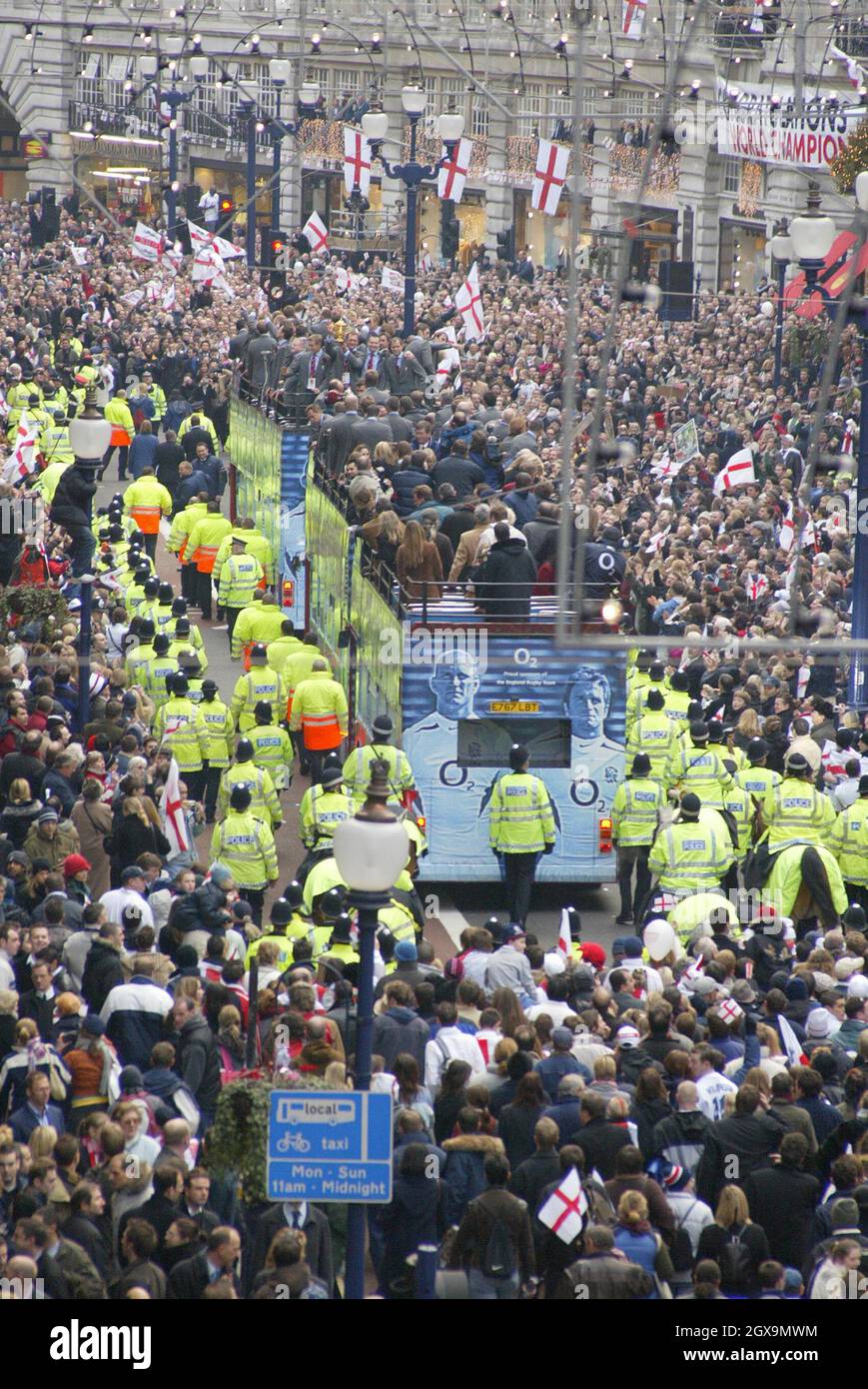The England rugby team bus makes its way through the thousands of ...