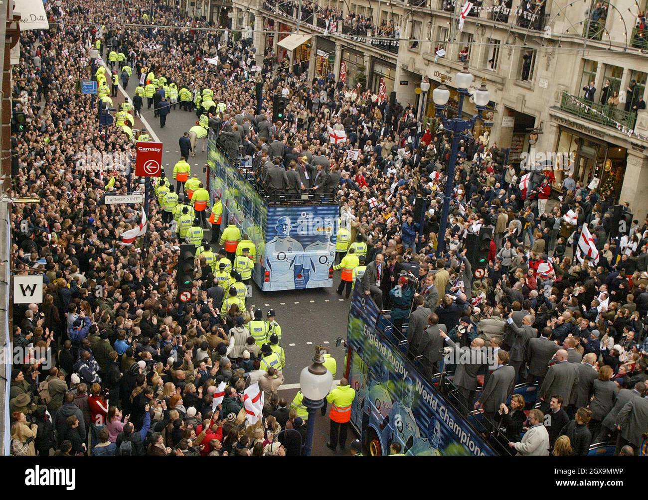 The England rugby team bus makes its way through the thousands of ...