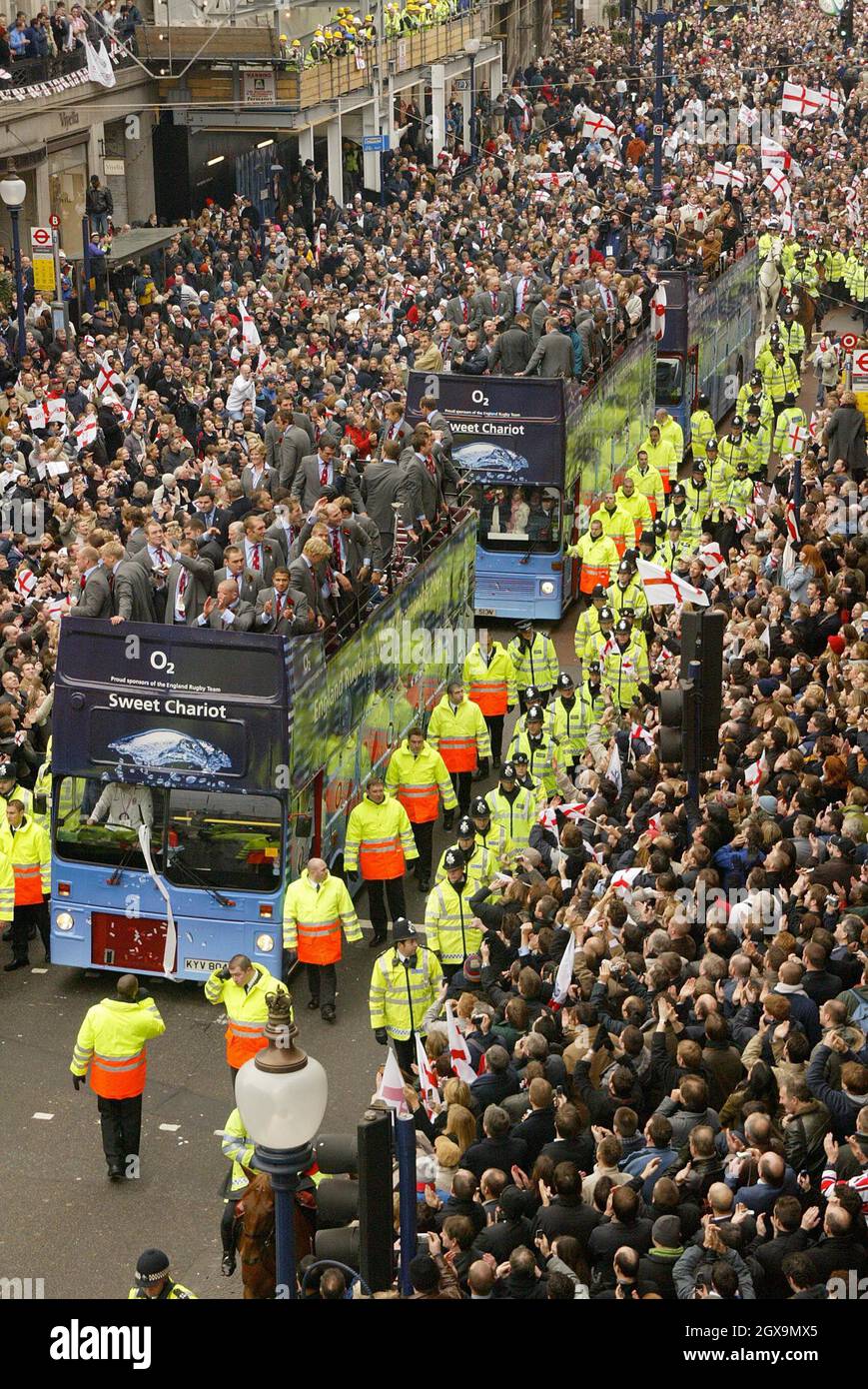 The England rugby team bus makes its way through the thousands of ...