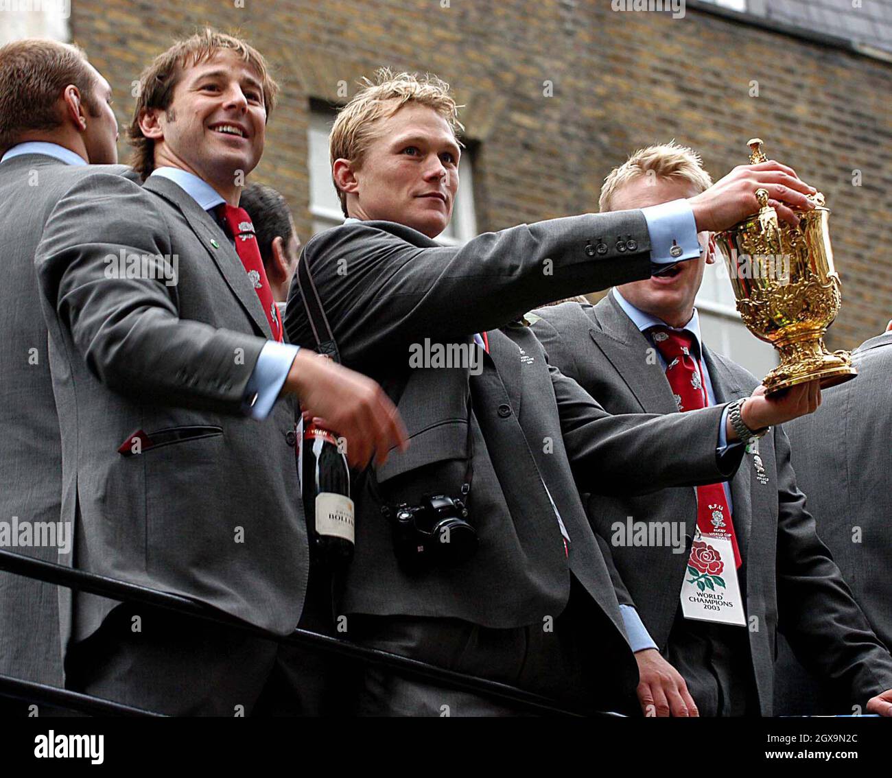 Josh Lewsey carries the Rugby Union World Cup on top of a bus as the ...