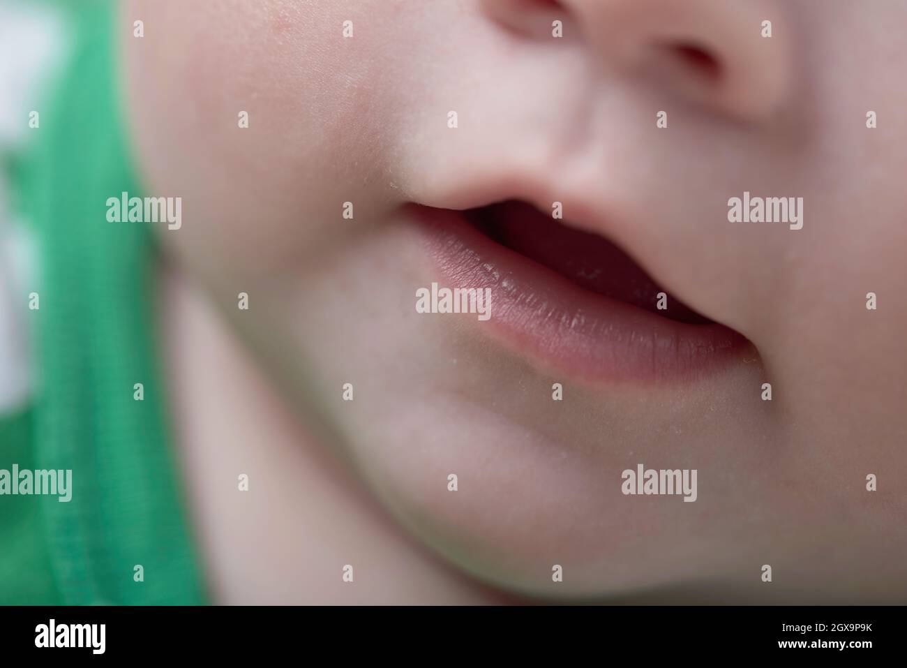 cute little baby playing with hand and smiling with no teeth funny ...