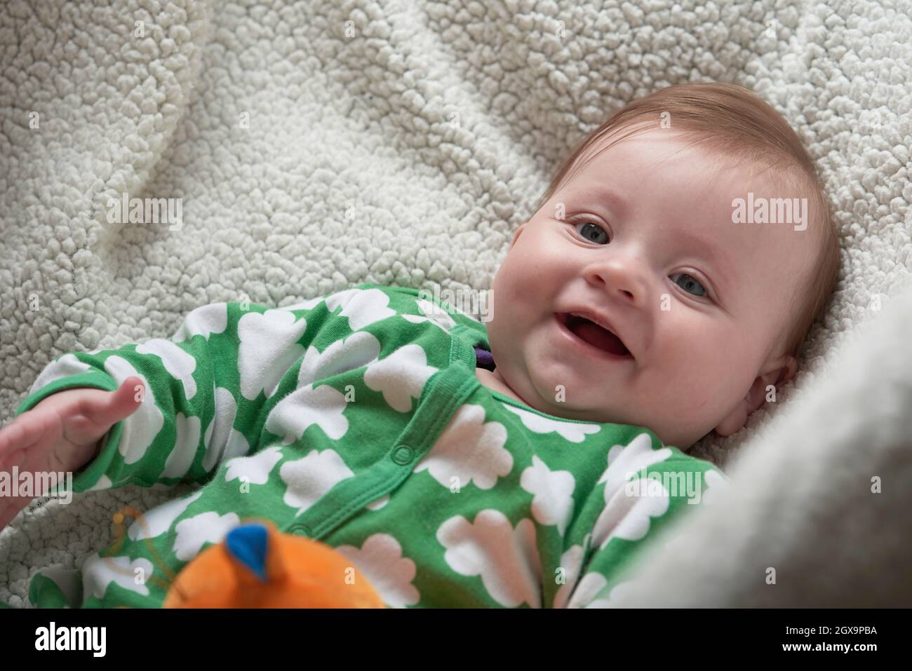 cute little baby playing with hand and smiling with no teeth funny ...